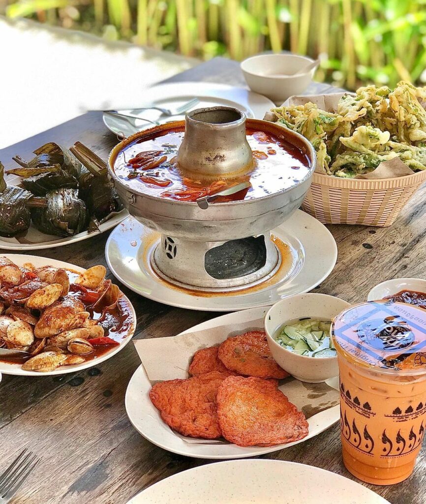 Khunthai Village Restaurant Has Hut-style Dining Seats & A Koi Pond